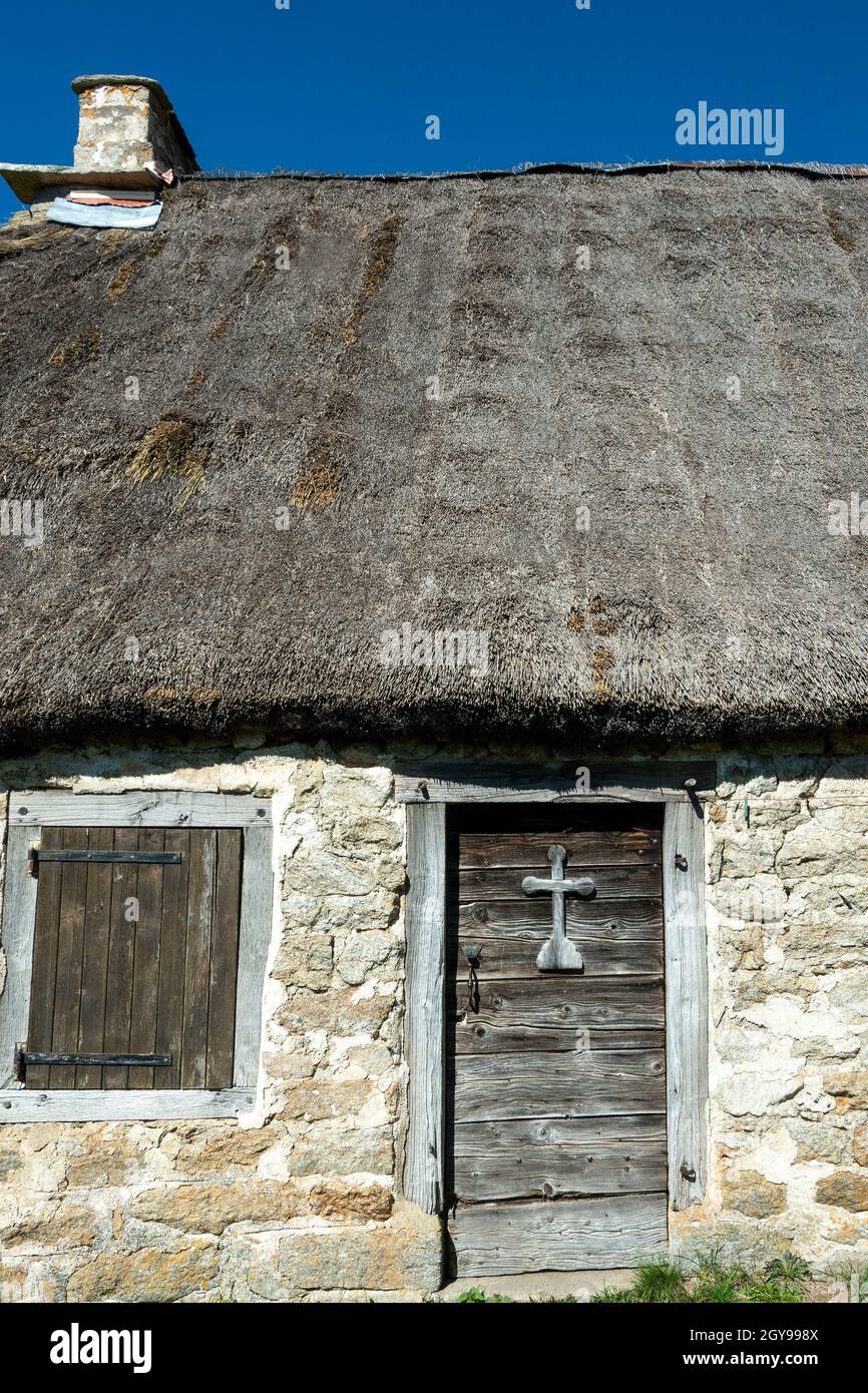 Wooden cross on a door of farm (jasserie), summer pasture specific to ...