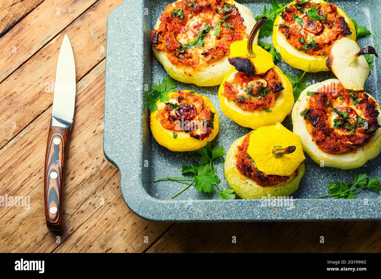 Squash stuffed with couscous and mushrooms. Baked patisson with ...