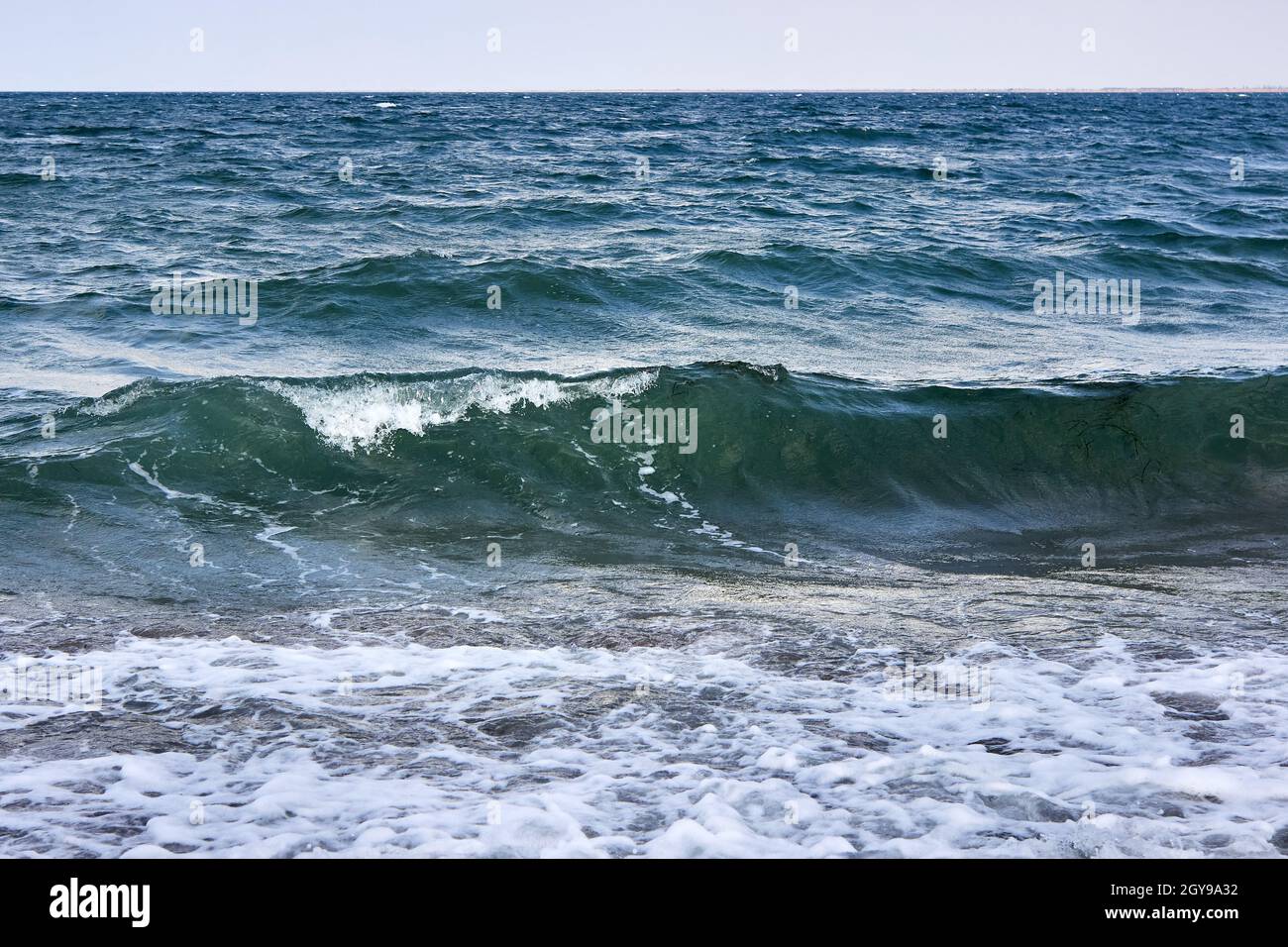The raging sea. Storm waves at sea. Dark sea, strong waves with bright ...