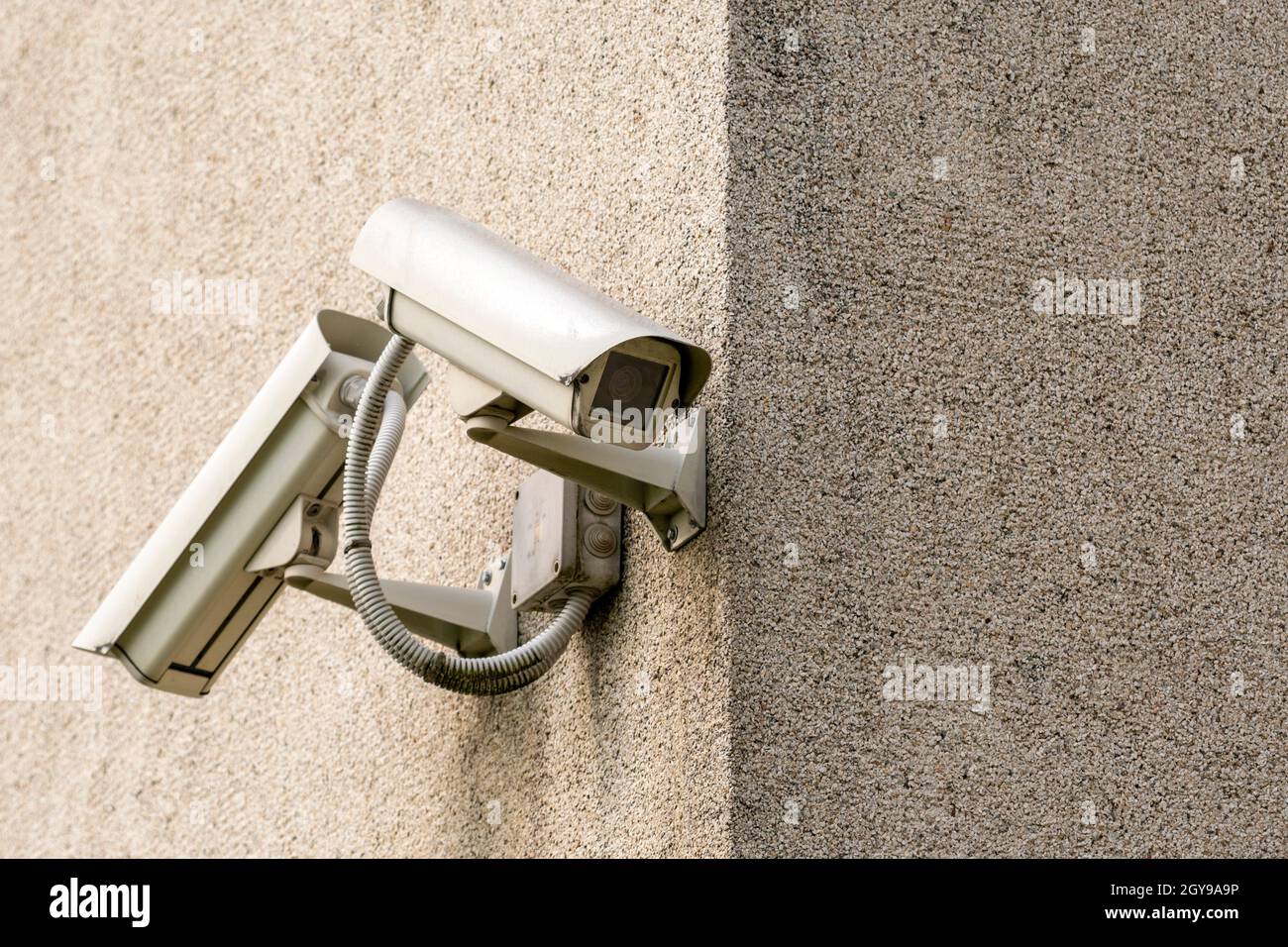 Two CCTV cameras on grey concrete wall. CCTV security system Stock ...