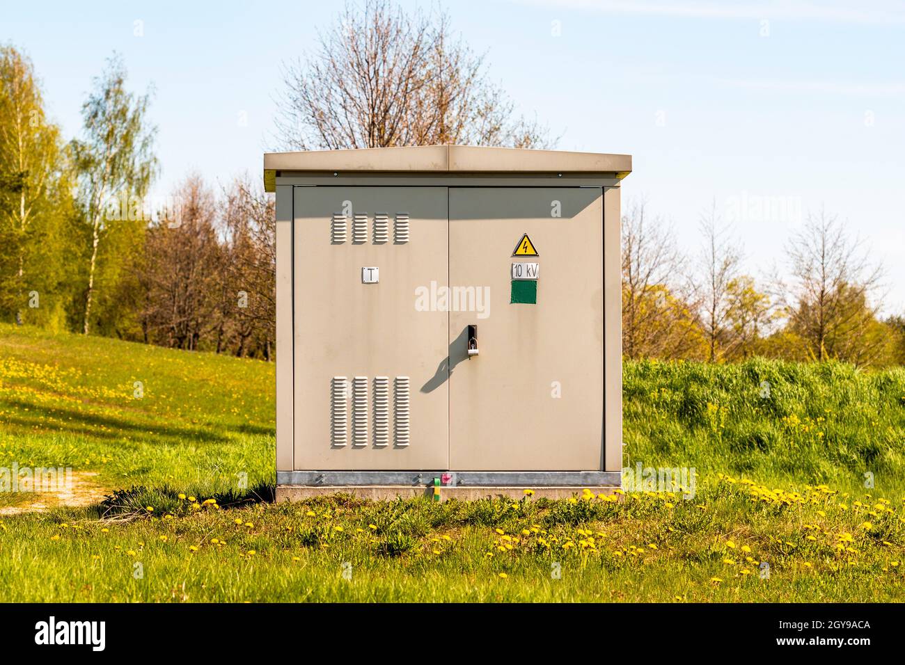 Outdoor electric high voltage distribution cabinet on a sunny spring ...
