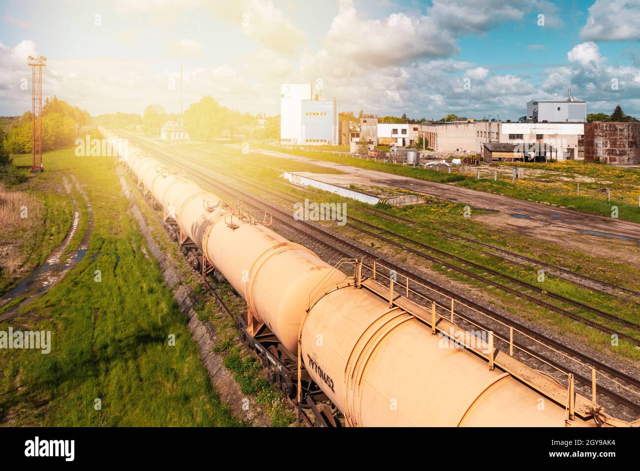 Cargo train passes by the station.Set of train tanks with fuel Stock ...
