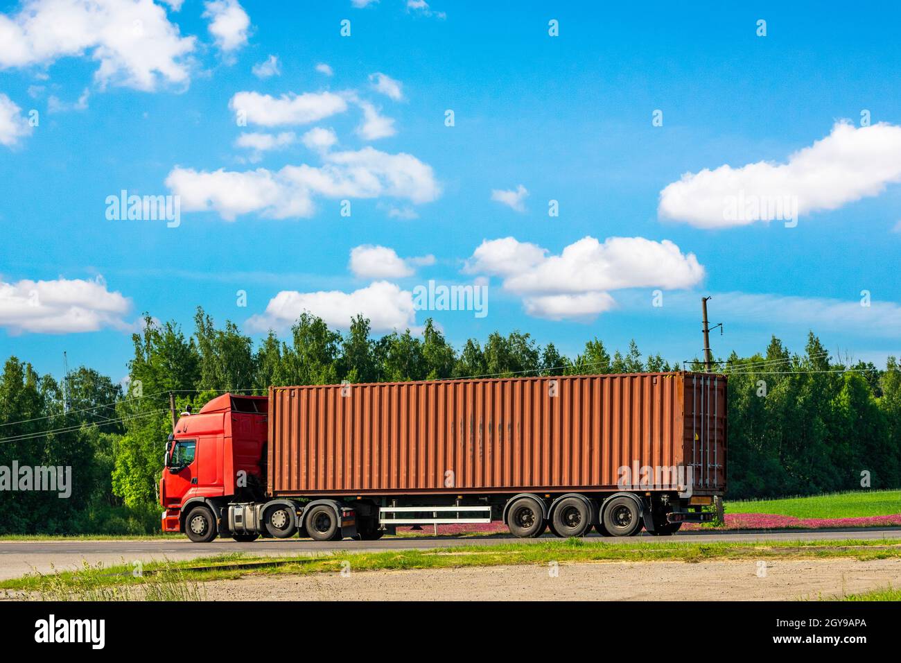 Truck on the road with red container. Cargo shipping and transportation ...