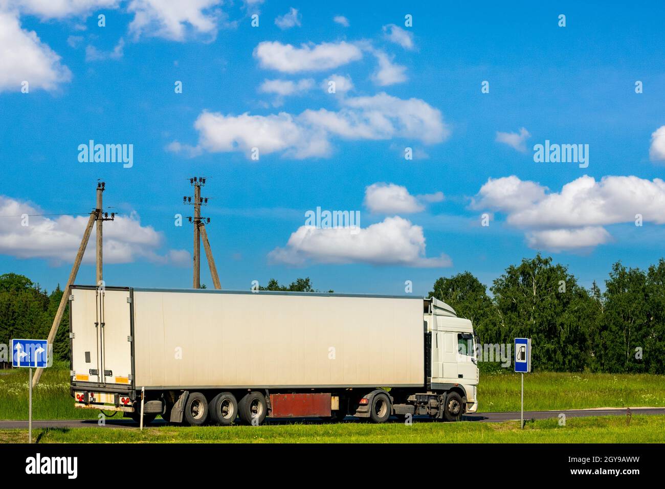 Road transport of goods by truck.Truck driving on the asphalt road in ...