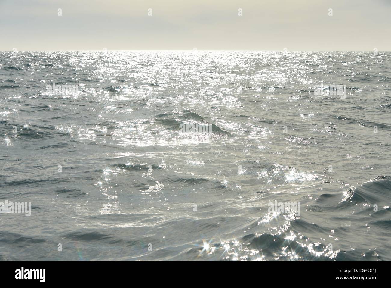 Horizon sea with waves after storm. sparkler in water - background. sea ...