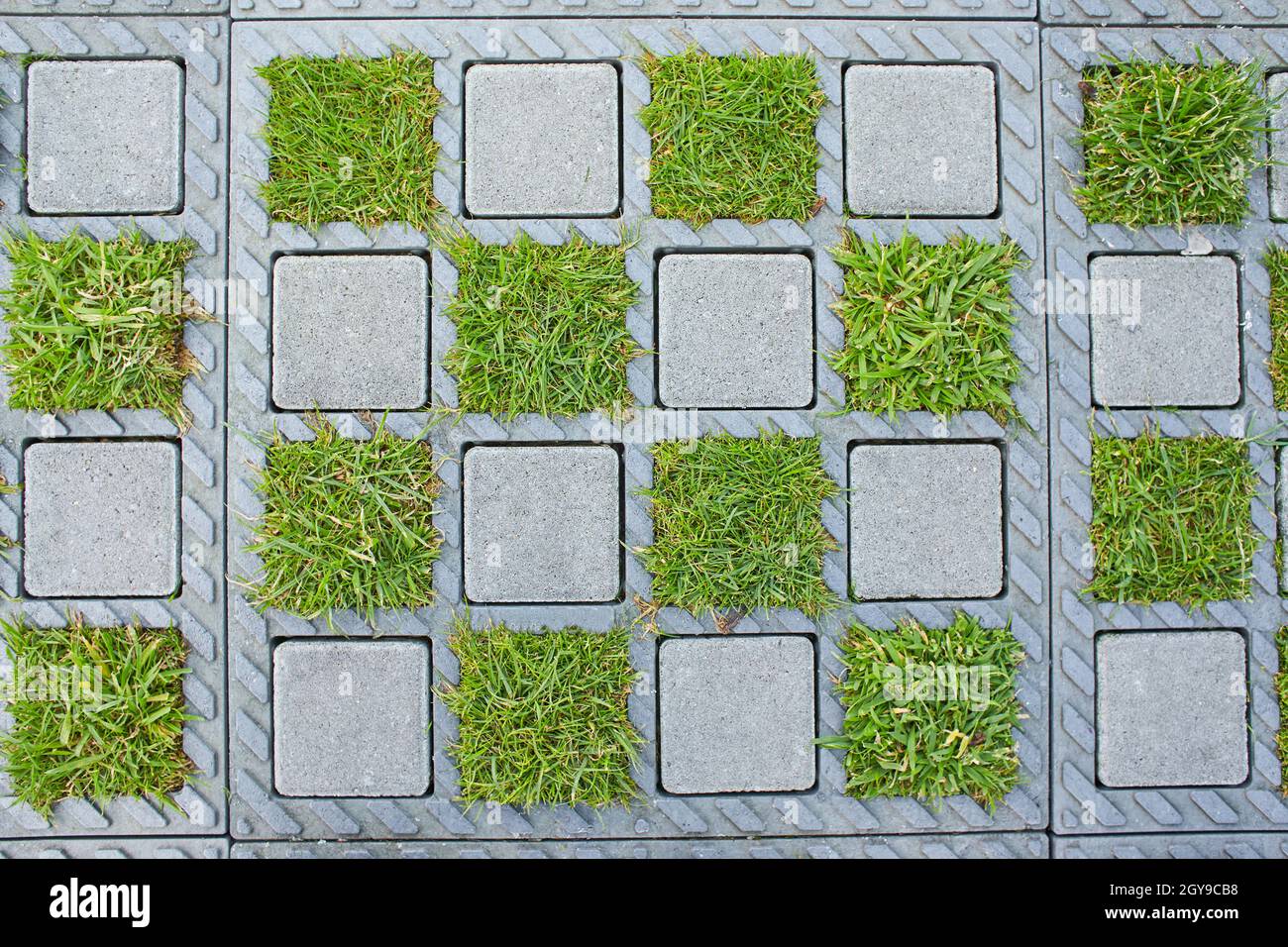 Sample of brick pavement with grass Stock Photo - Alamy