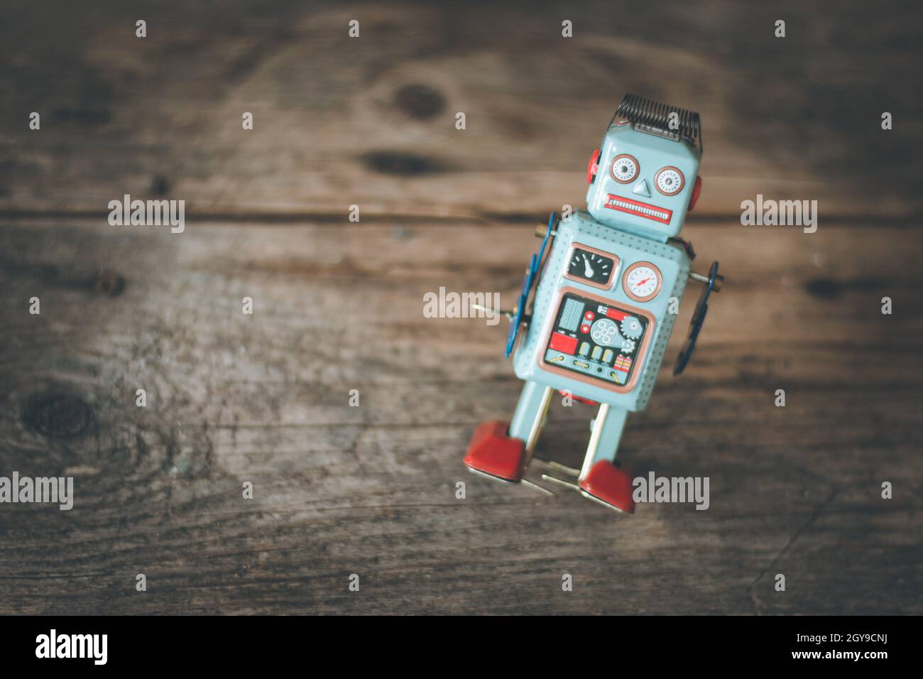 Robot toy, symbol for a chatbot or social bot and algorithms. Wood ...