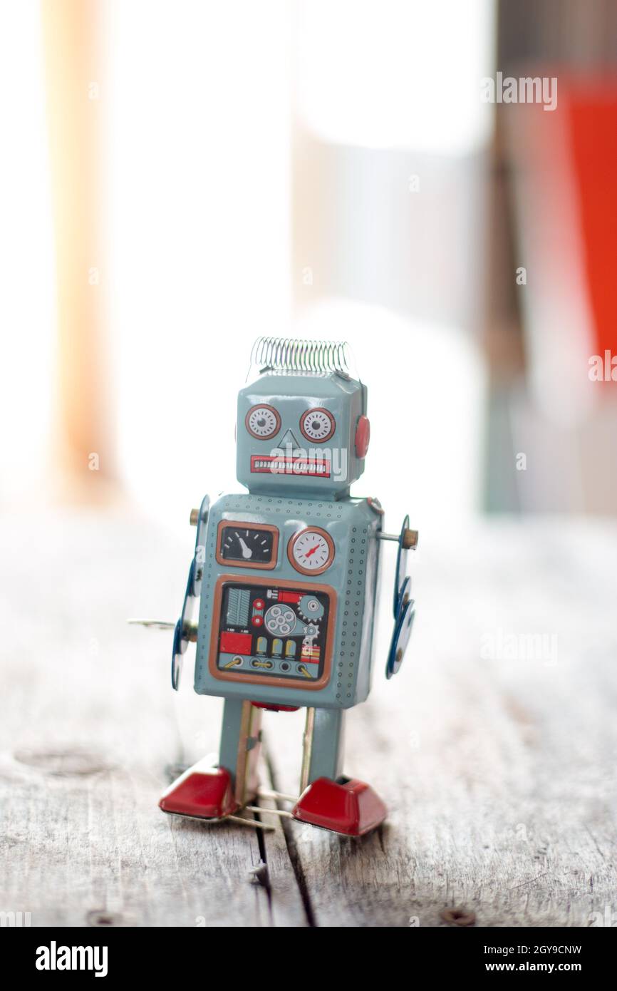 Robot toy, symbol for a chatbot or social bot and algorithms. Wood ...