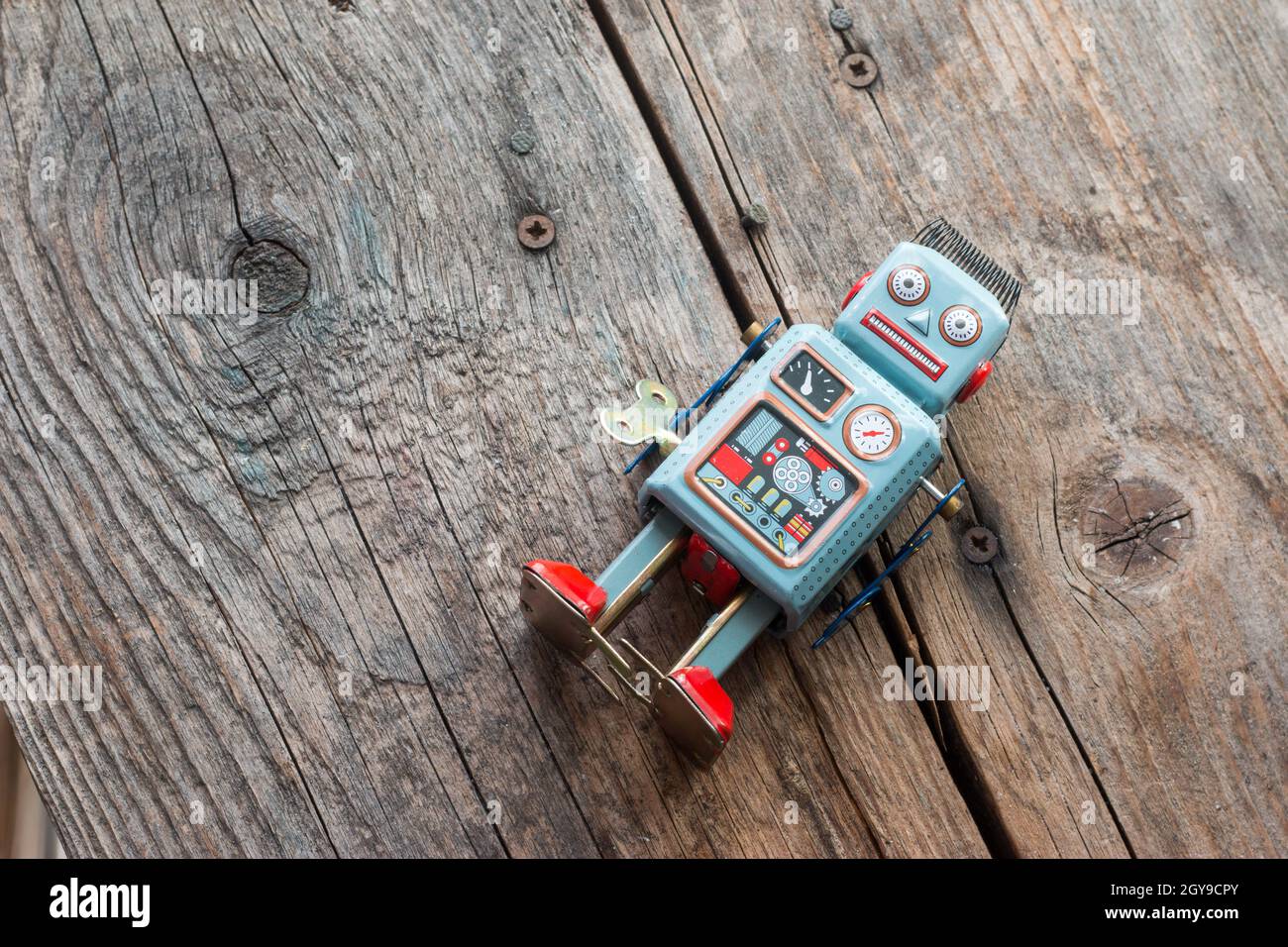 Robot toy, symbol for a chatbot or social bot and algorithms. Wood ...