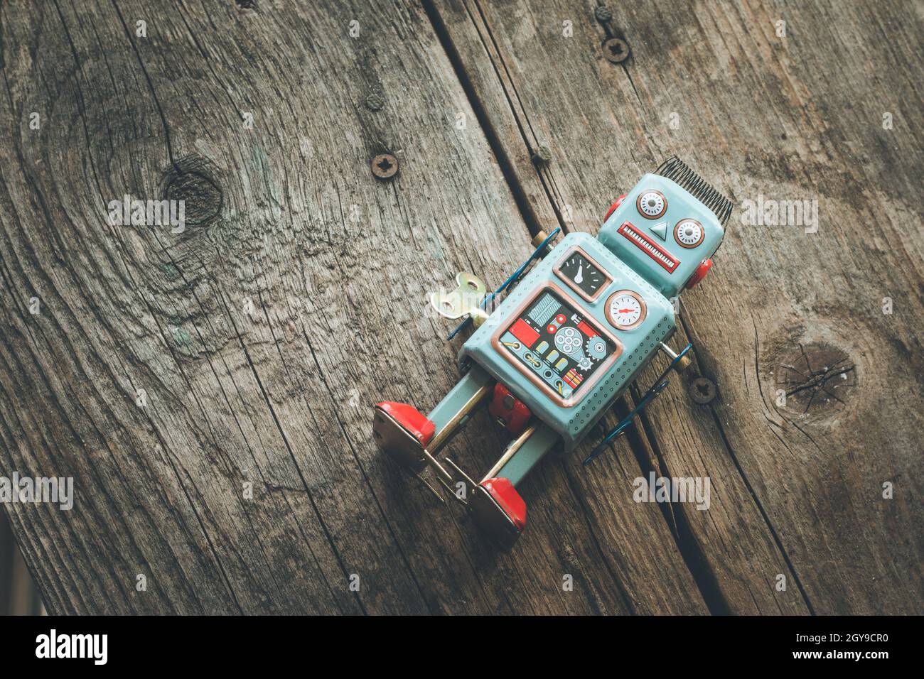 Robot toy, symbol for a chatbot or social bot and algorithms. Wood ...