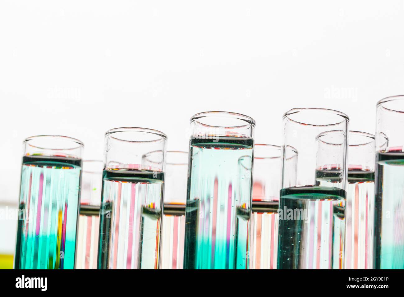 Glass laboratory chemical test tubes with liquid for analysis close up ...