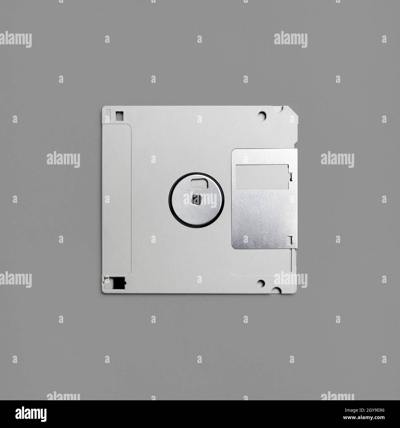 Floppy disk on gray paper background. Gray diskette. Top view. Flat lay ...