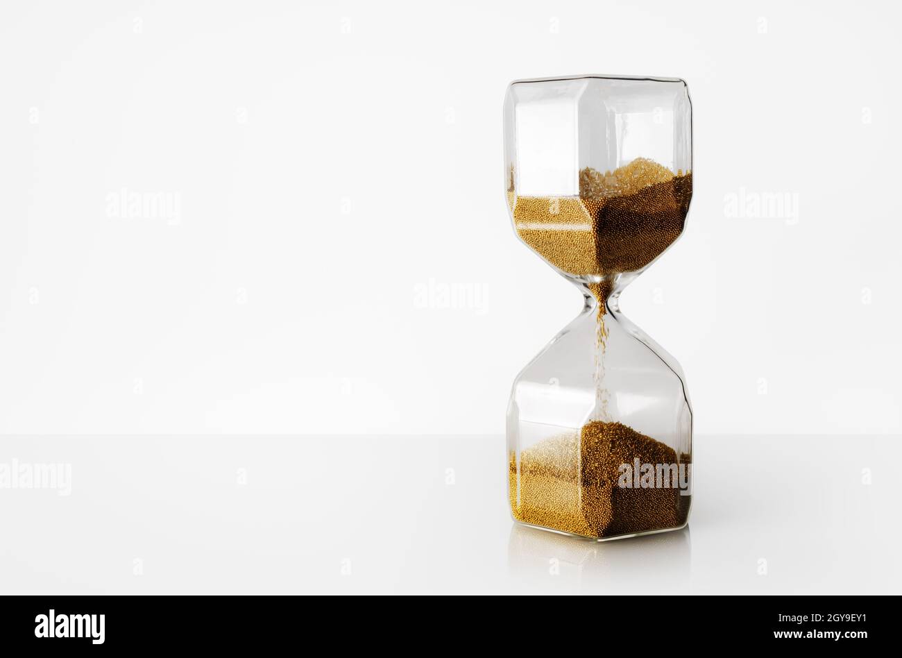 Hourglass on light background with copy space. Time Running Out Stock ...