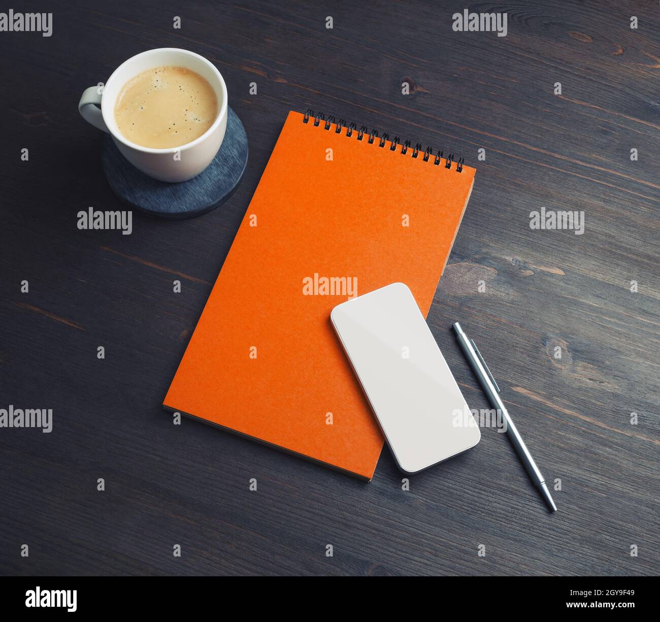 Blank business template. Blank orange notebook, smartphone, coffee cup ...