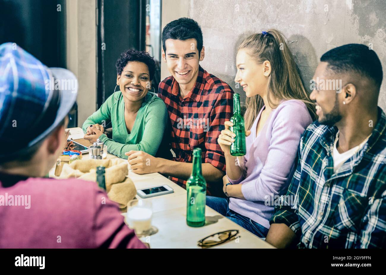 Multiracial friends group drinking beer and having fun at fashion ...