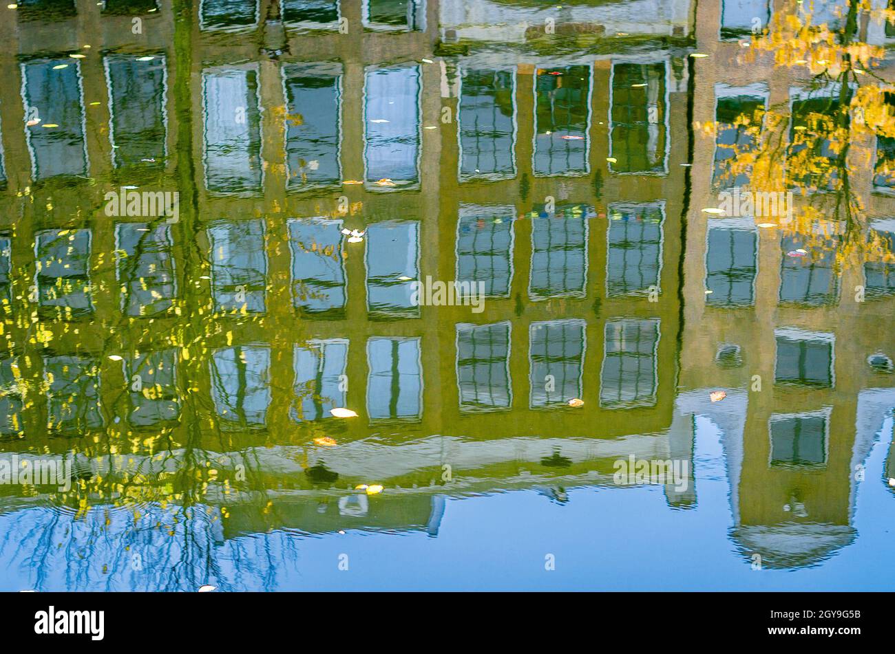 Vibrant reflection of the colorful buildings along the canal in ...
