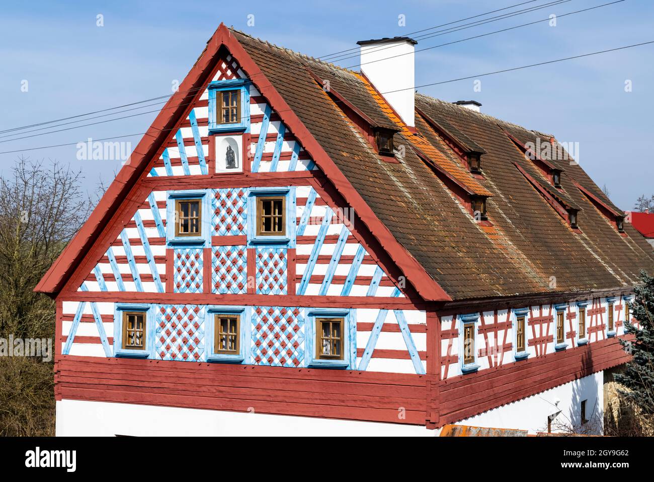 Half-timbered farmhouse, folk architecture in Milhostov, Western ...