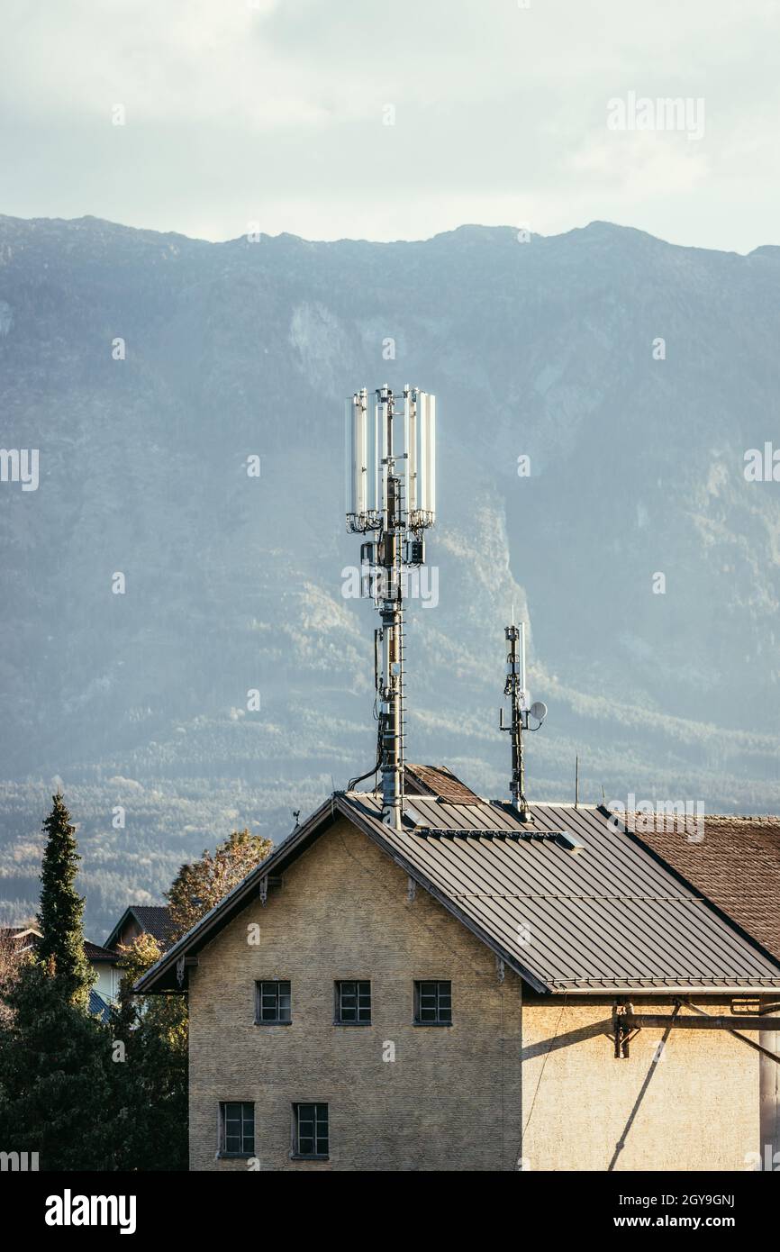 Communication transmitter on the rooftop of a house Stock Photo - Alamy