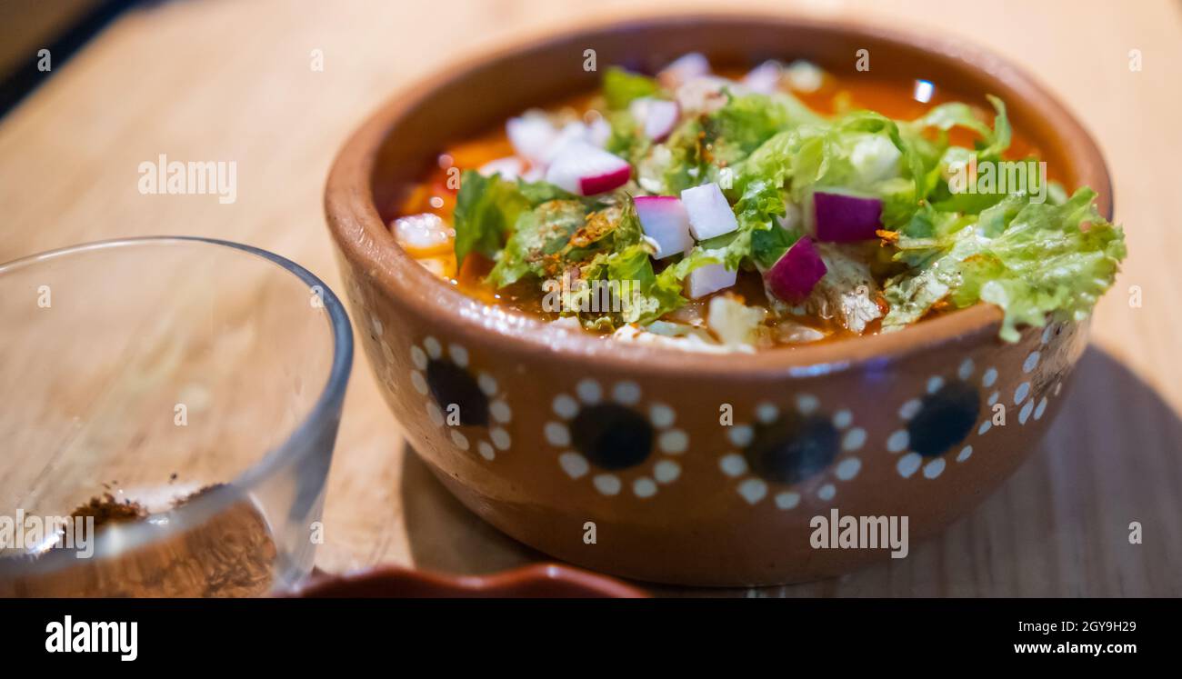 Clay bowl of delicious and traditional Mexican pozole Stock Photo - Alamy