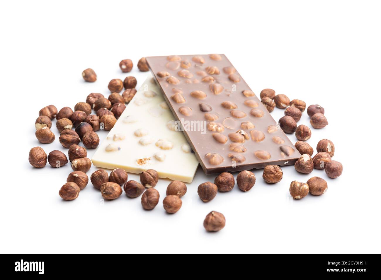 White and dark chocolate bars with hazelnuts isolated on white ...
