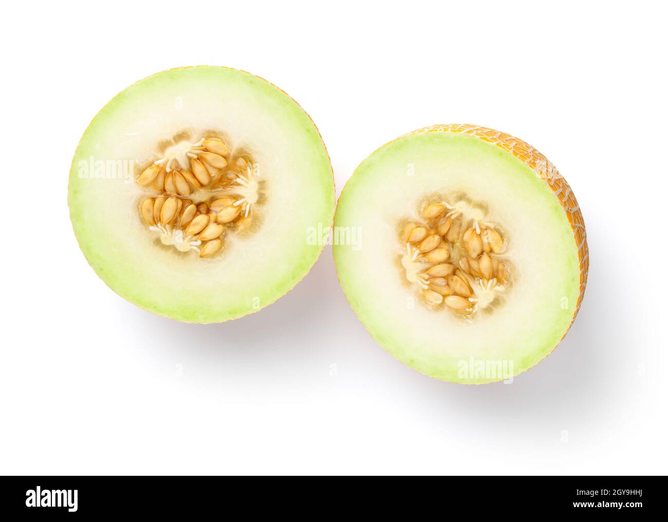 Galia melon cut in half isolated on white background. View from above ...
