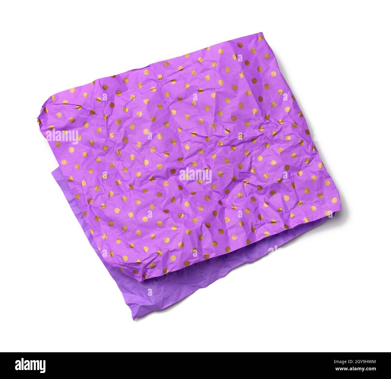 piece of folded crumpled purple paper for wrapping a gift isolated on ...