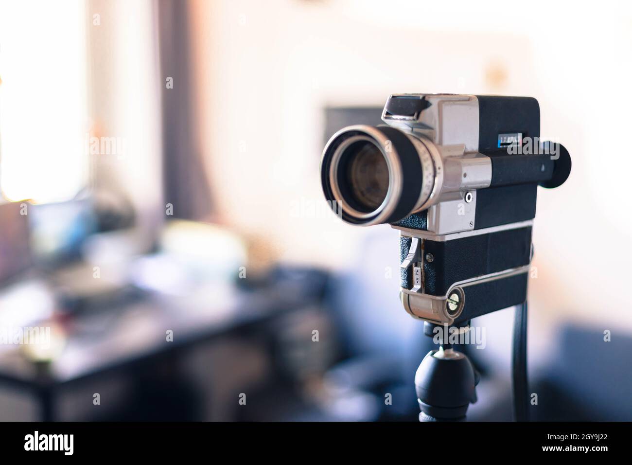 Vintage old movie camera indoor, copy space Stock Photo - Alamy