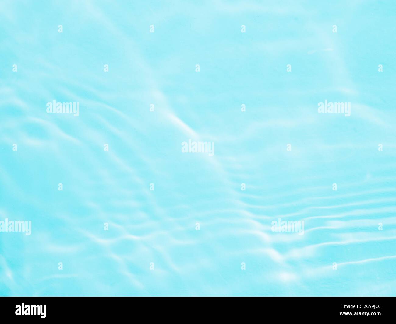 Ripple water texture on blue pool background. Shadow of water on ...