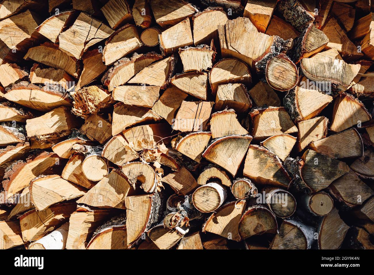 Background of a stack pile of chopped wood Stock Photo - Alamy