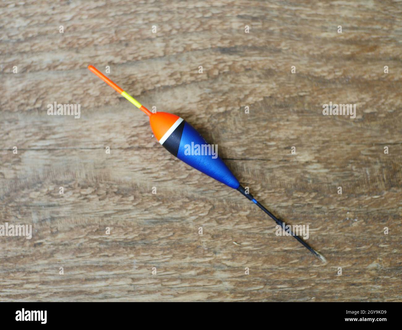 big red-blue float with a red antenna close-up, float for fishing ...