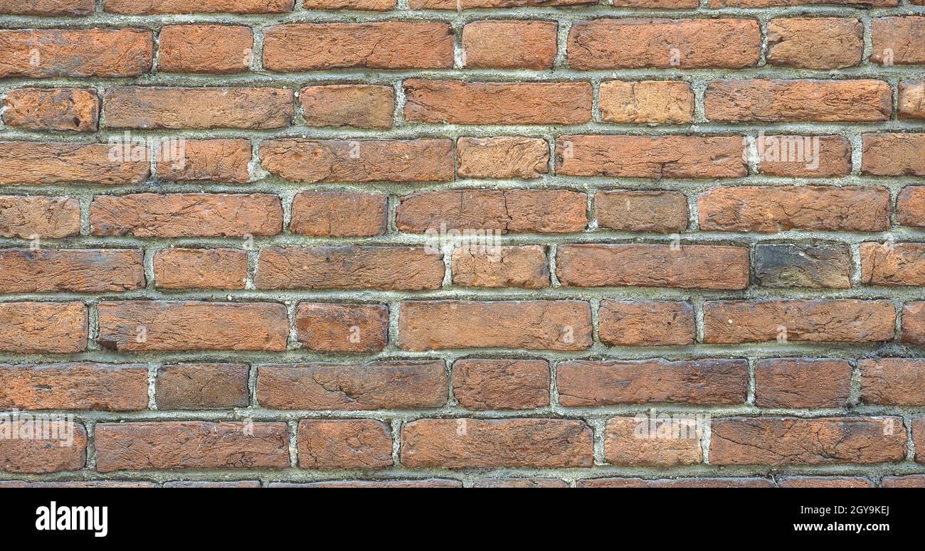 wide 4K red brick wall useful as a background Stock Photo - Alamy