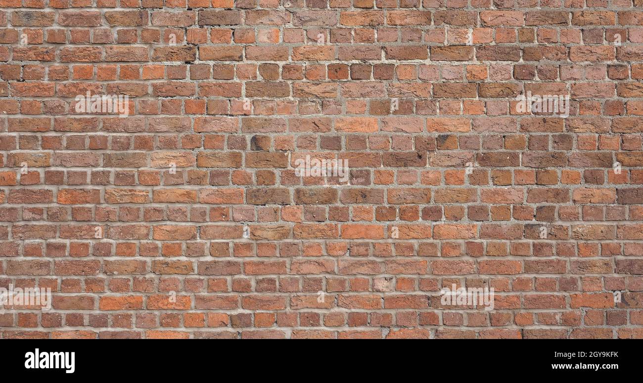 wide 4K red brick wall useful as a background Stock Photo - Alamy