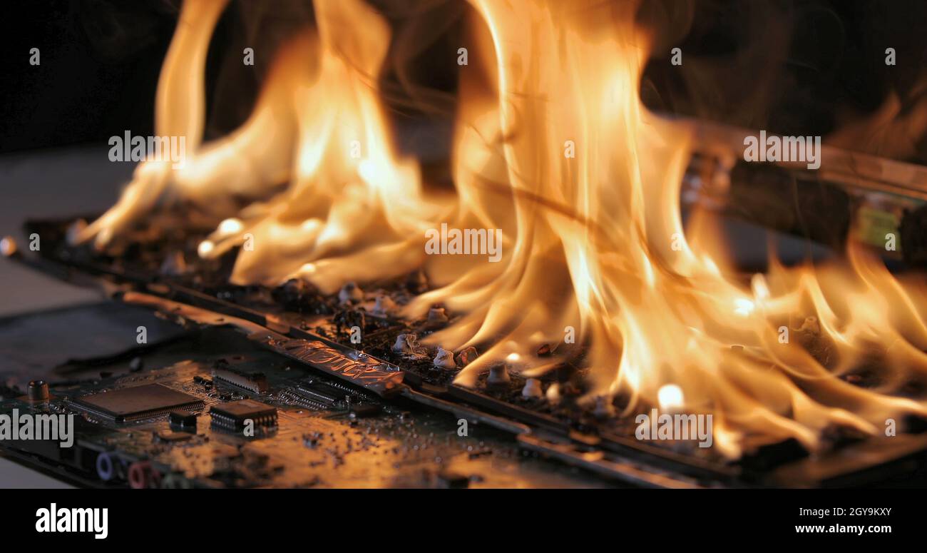 Computer laptop burning flames hi-res stock photography and images - Alamy