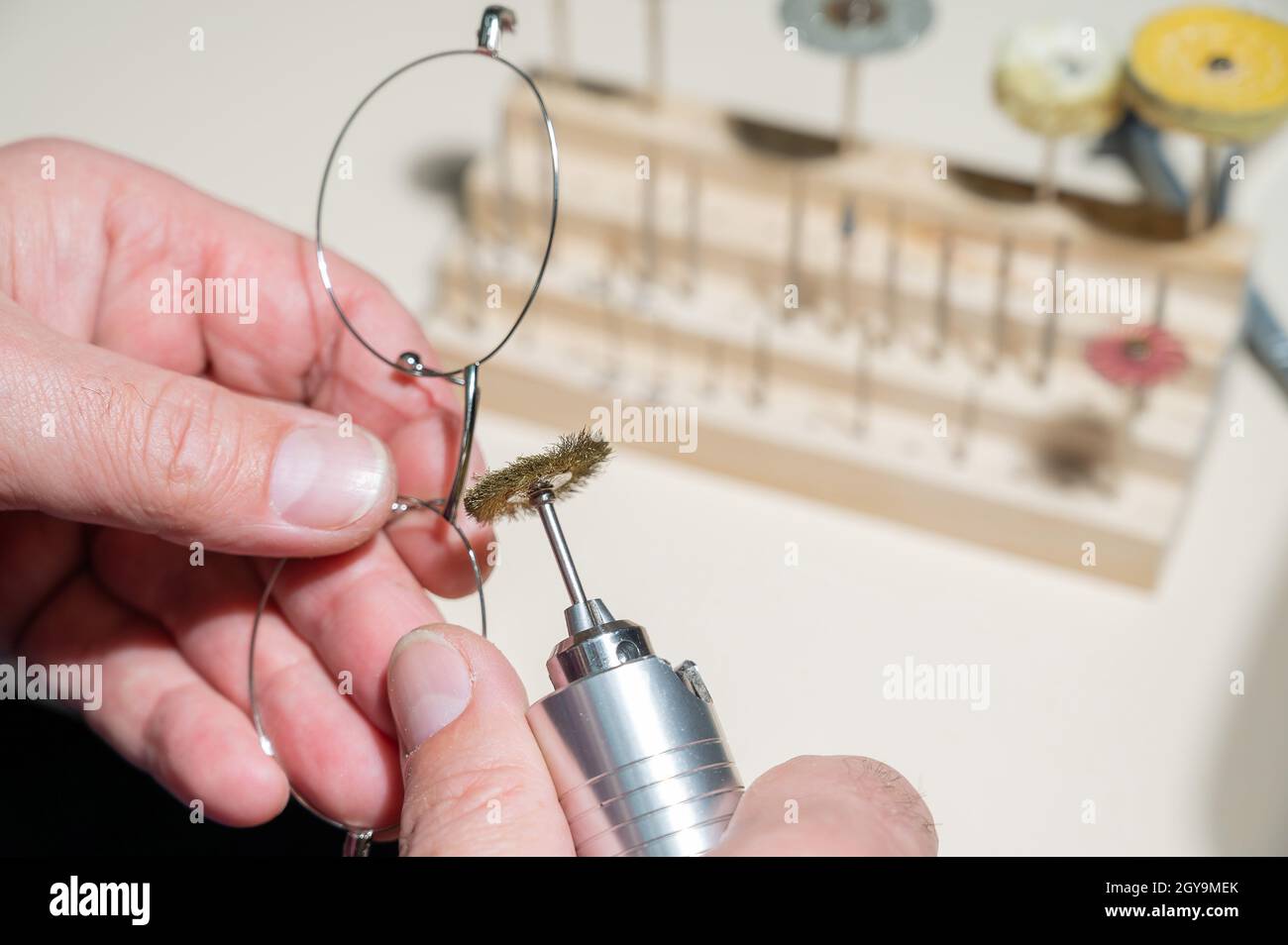 Optician technician polishes frame hi-res stock photography and images ...