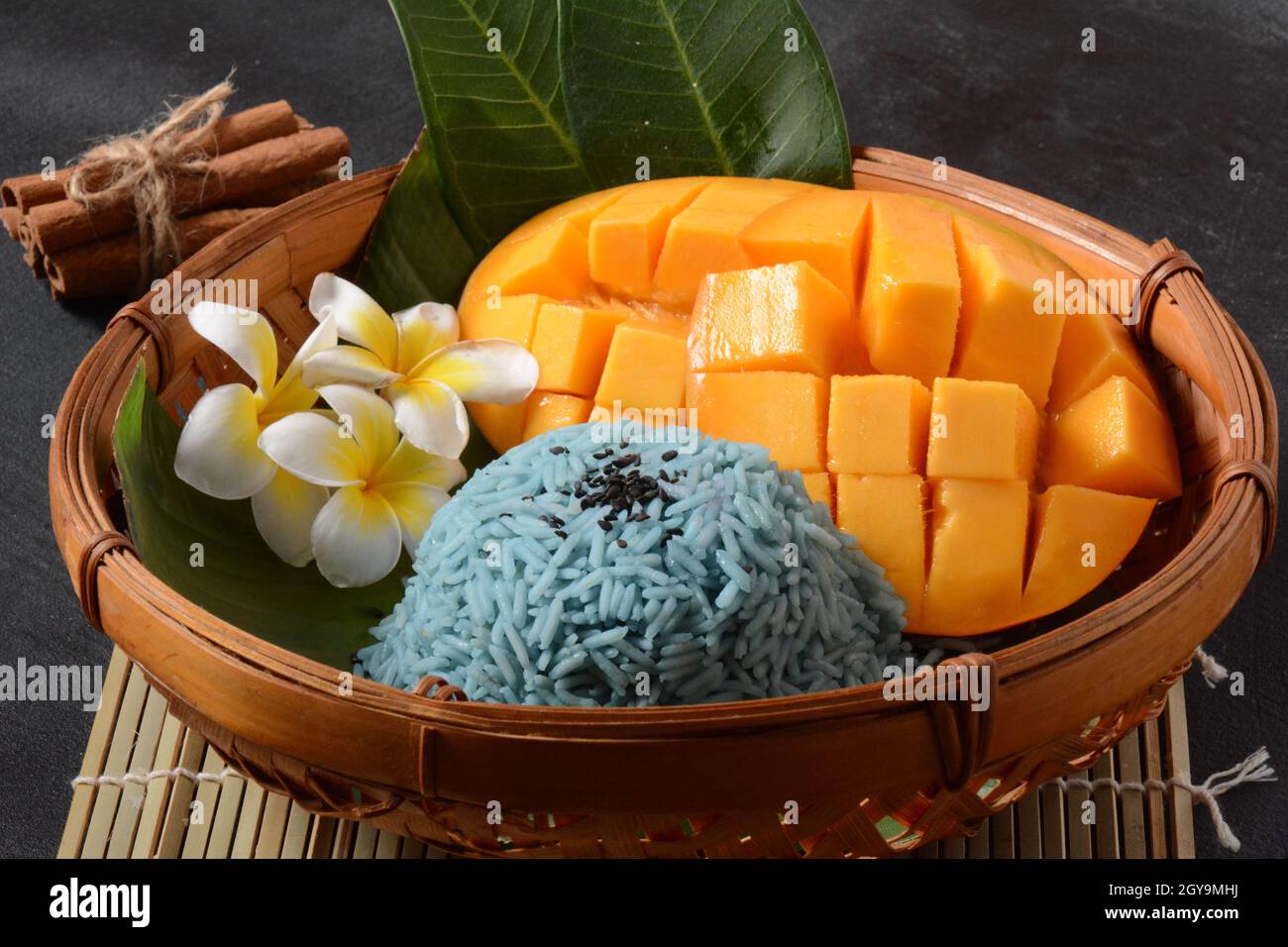 Mango and sticky rice, Thai sweet dessert, colored with butterfly pea ...