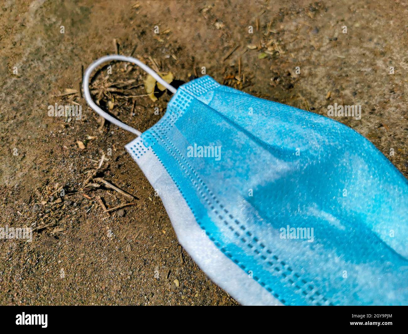 Surgical blue masks on the ground. Corona virus pollution in Costa Rica ...