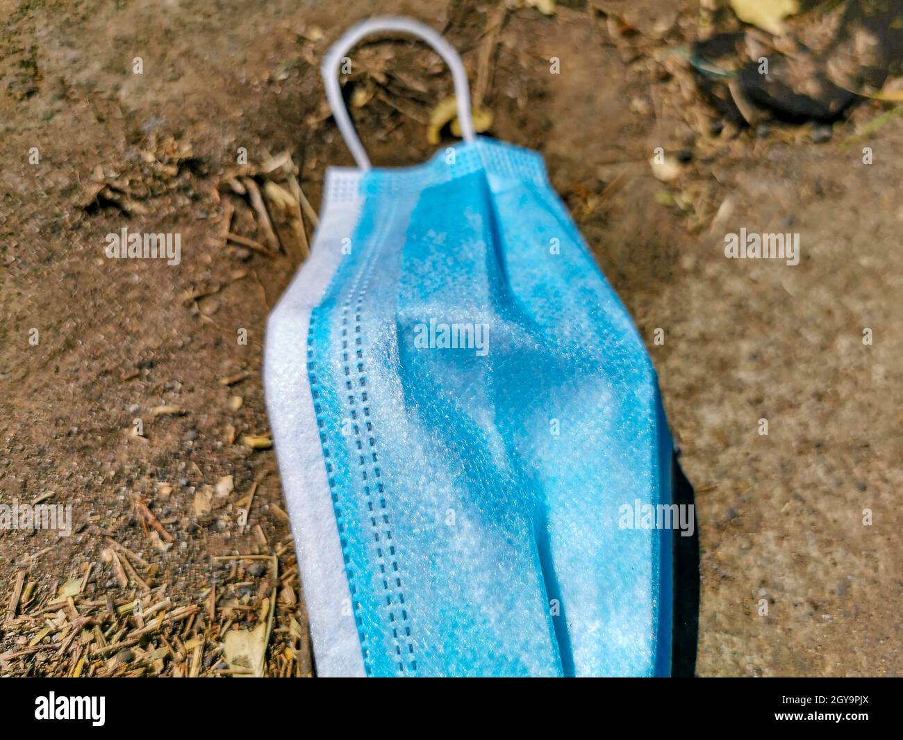 Surgical blue masks on the ground. Corona virus pollution in Costa Rica ...