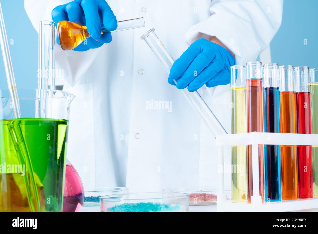 Scientific experiments in a chemistry lab. Color liquids and test tube ...