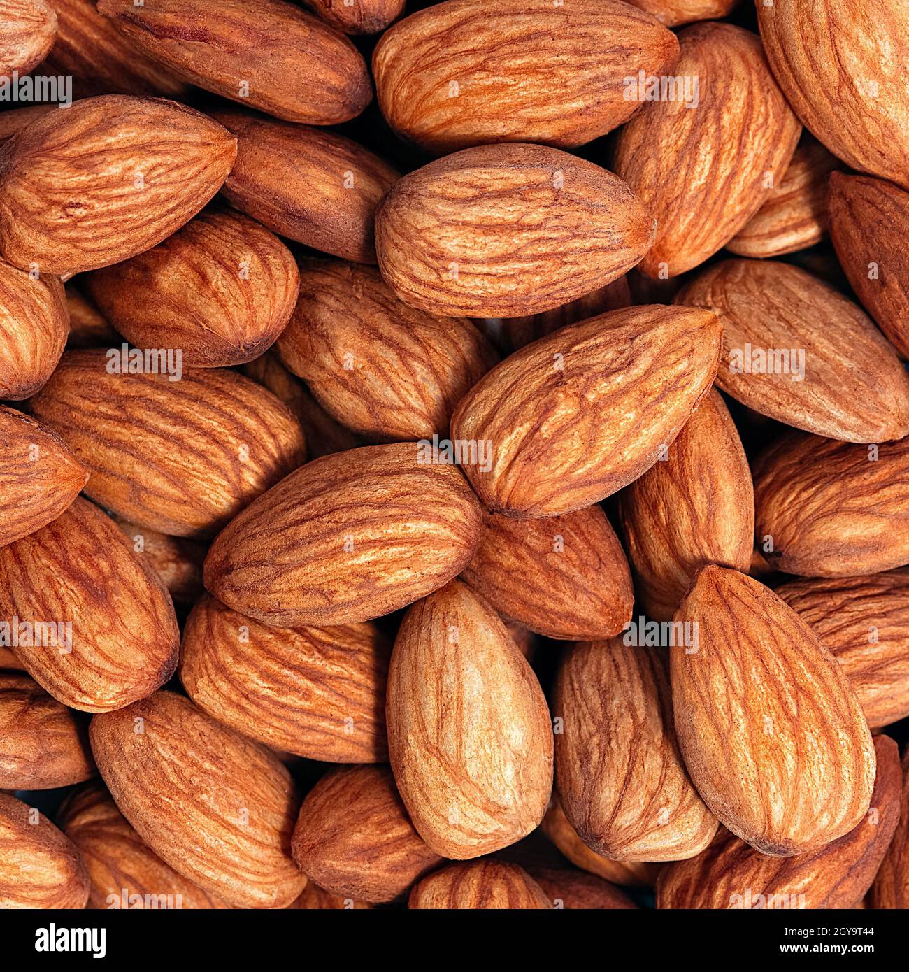 Background of almonds. Fried almonds. Scattered almond grains ...