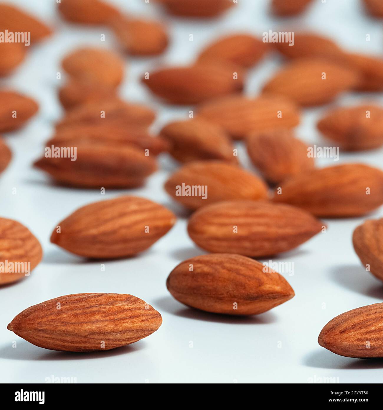 Background of almonds. Fried almonds. Scattered almond grains ...
