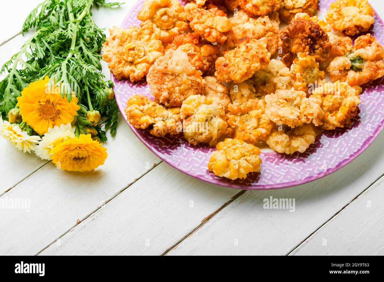Delicious fried edible flowers. Chrysanthemum flowers in batter Stock ...