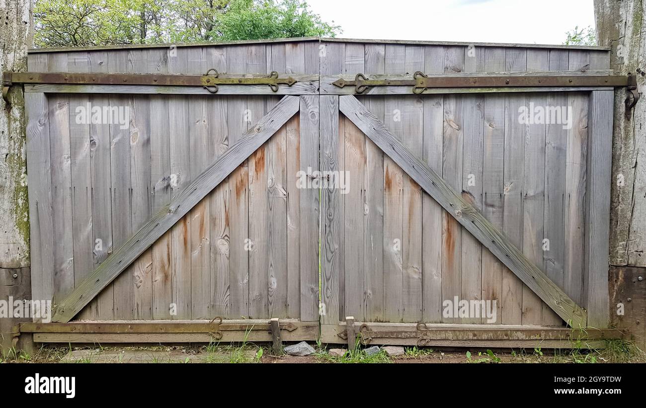 Closed wooden gate from the boards in the village or village. Vintage ...