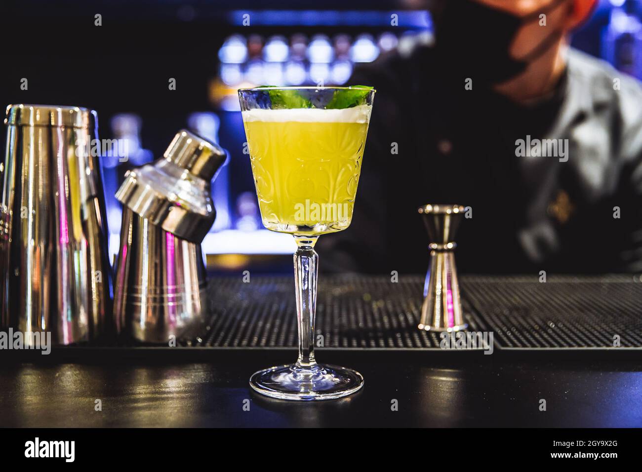 Yellow cocktail on the bar Stock Photo - Alamy