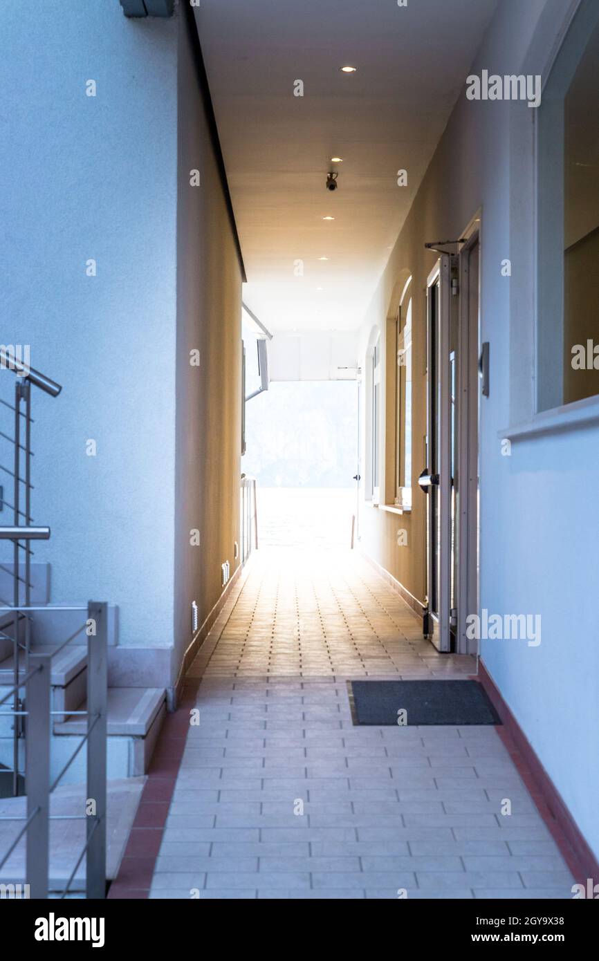 Bright passage between two buildings, natural light Stock Photo - Alamy