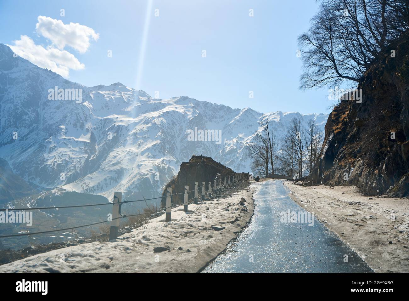 Dangerous winding road among the mountains. Mountain streamer in early ...