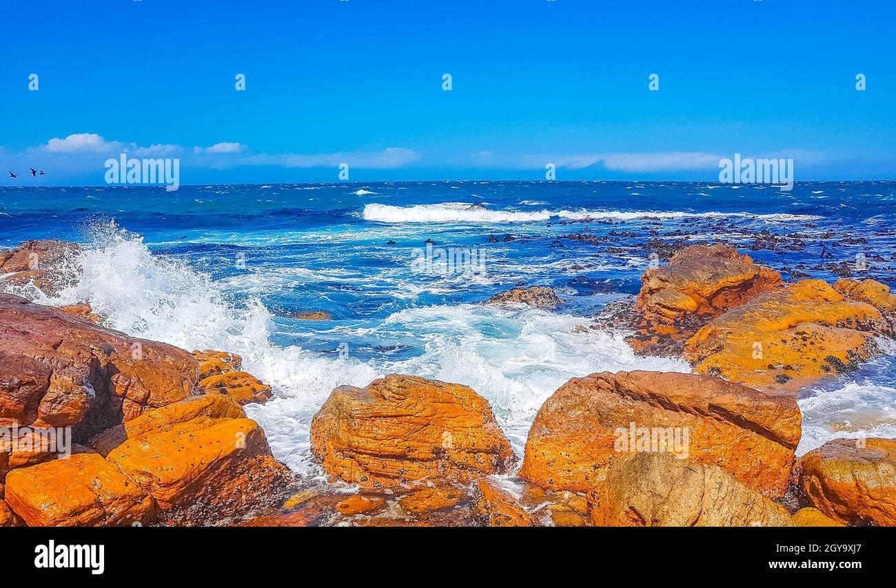 False Bay rough coast landscape with boulders waves and mountains with ...