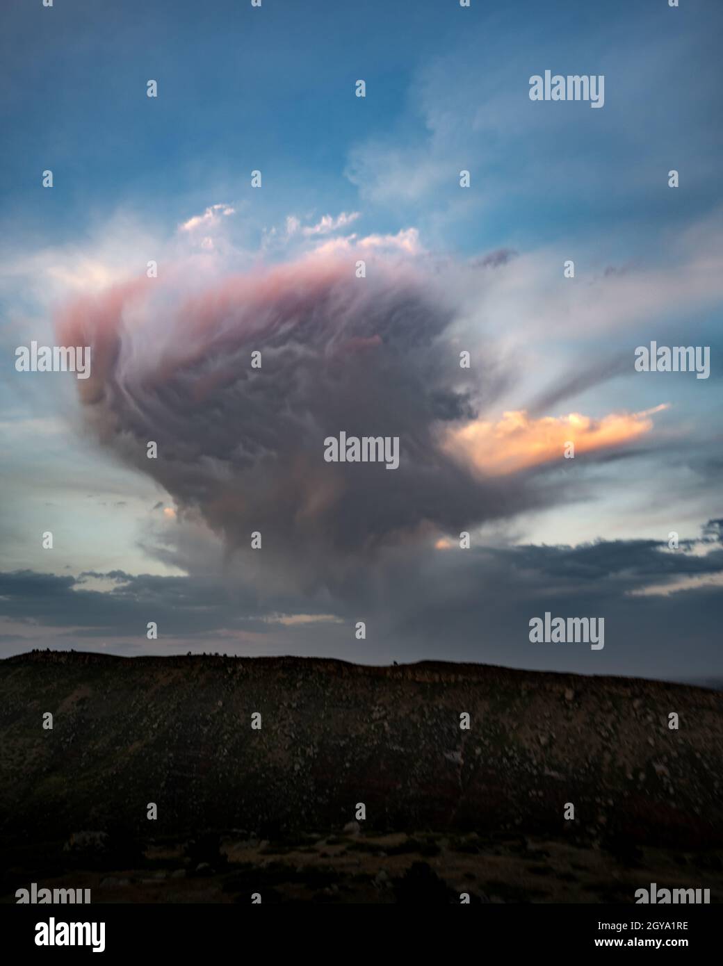 A unique and intense pink cloud forms over the plains of Colorado Stock ...