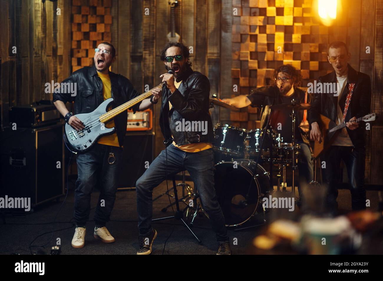 Brutal artists, music and song performing on stage. Rock band ...