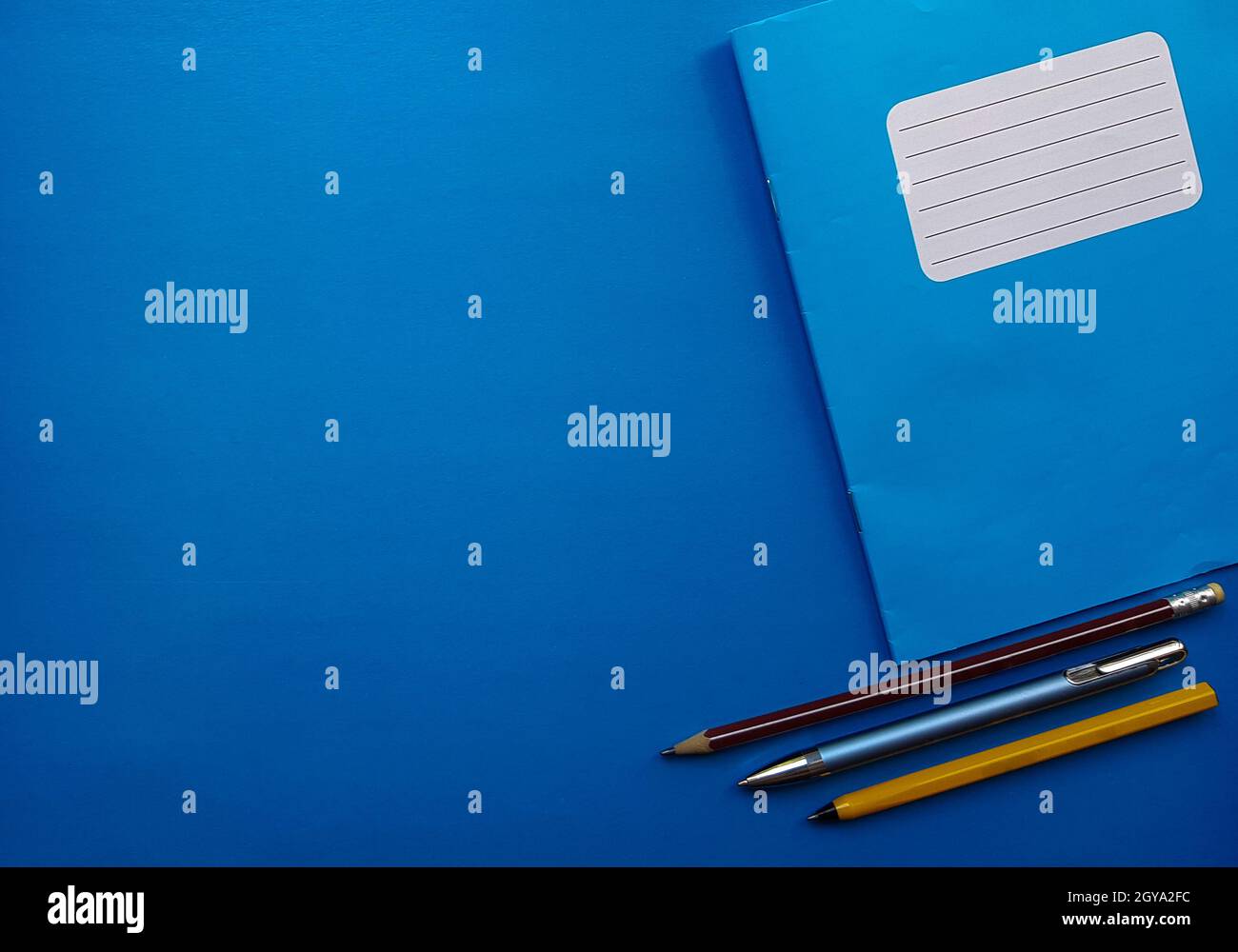 Old copybook on a blue background. School notebook, preparation for ...