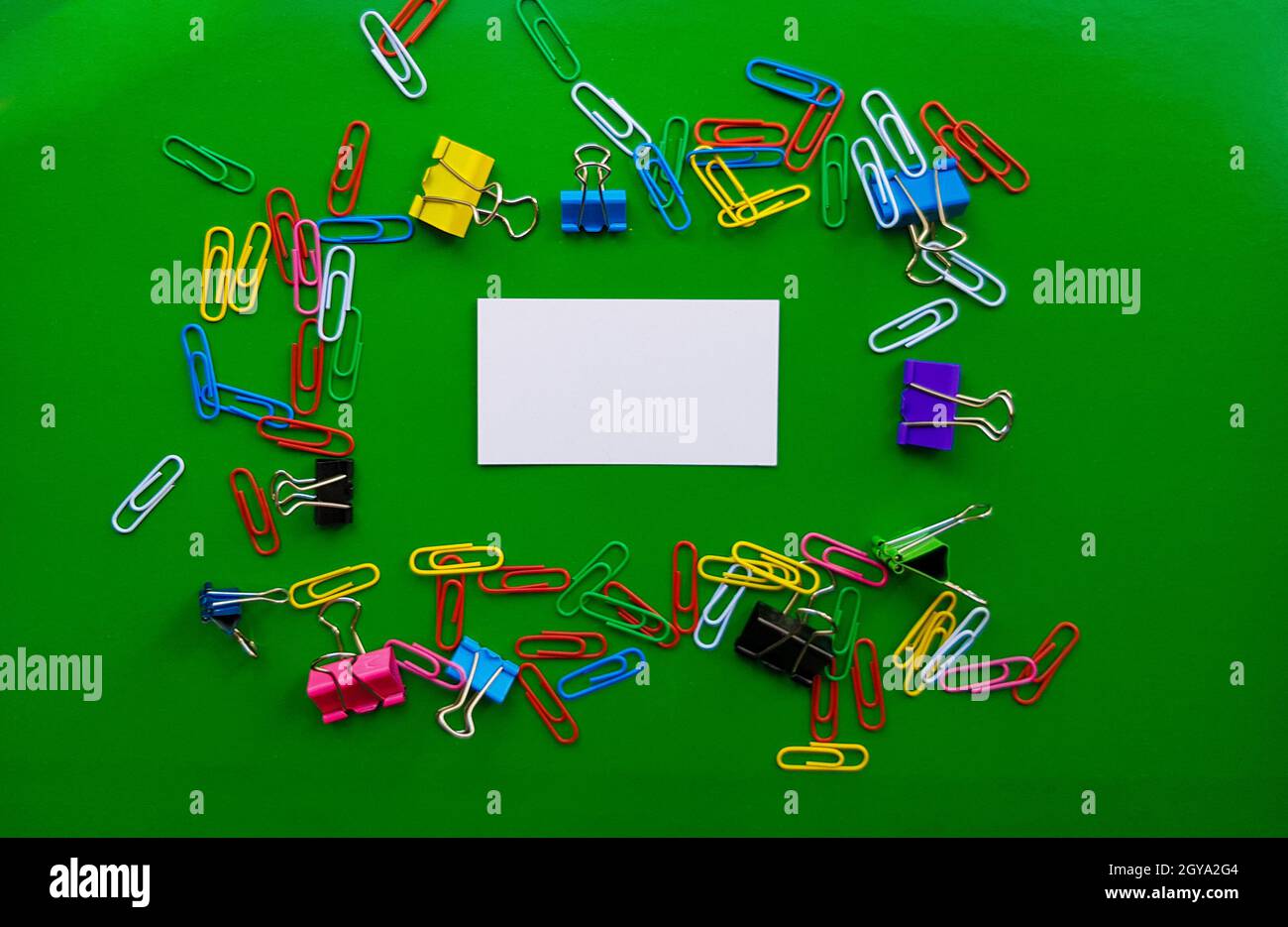 pile of paper clips isolated on green background, documents, office ...